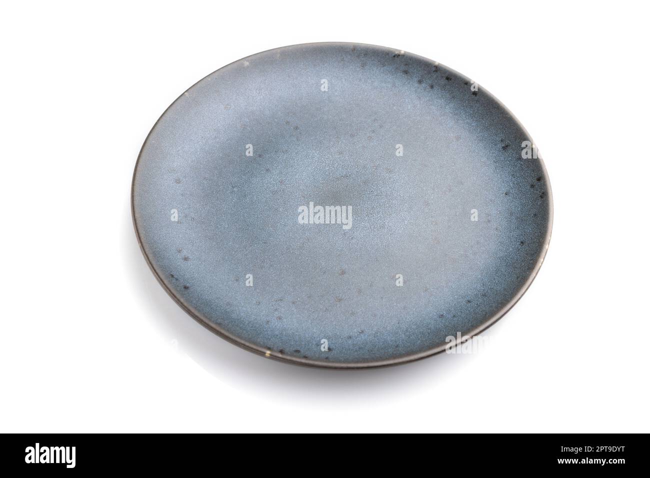 Empty blue ceramic plate isolated on white background. Side view, close ...