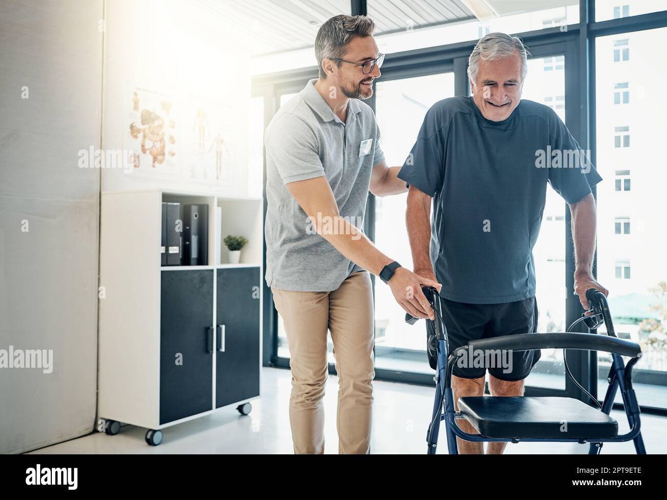 Walking the road to recovery together. a caring physiotherapist helping ...