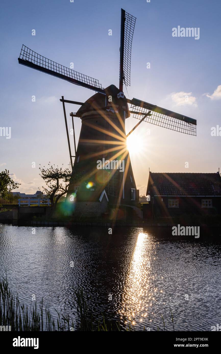 Europe, Netherlands, South Holland, Kinderdijk. Sihlouette of a ...