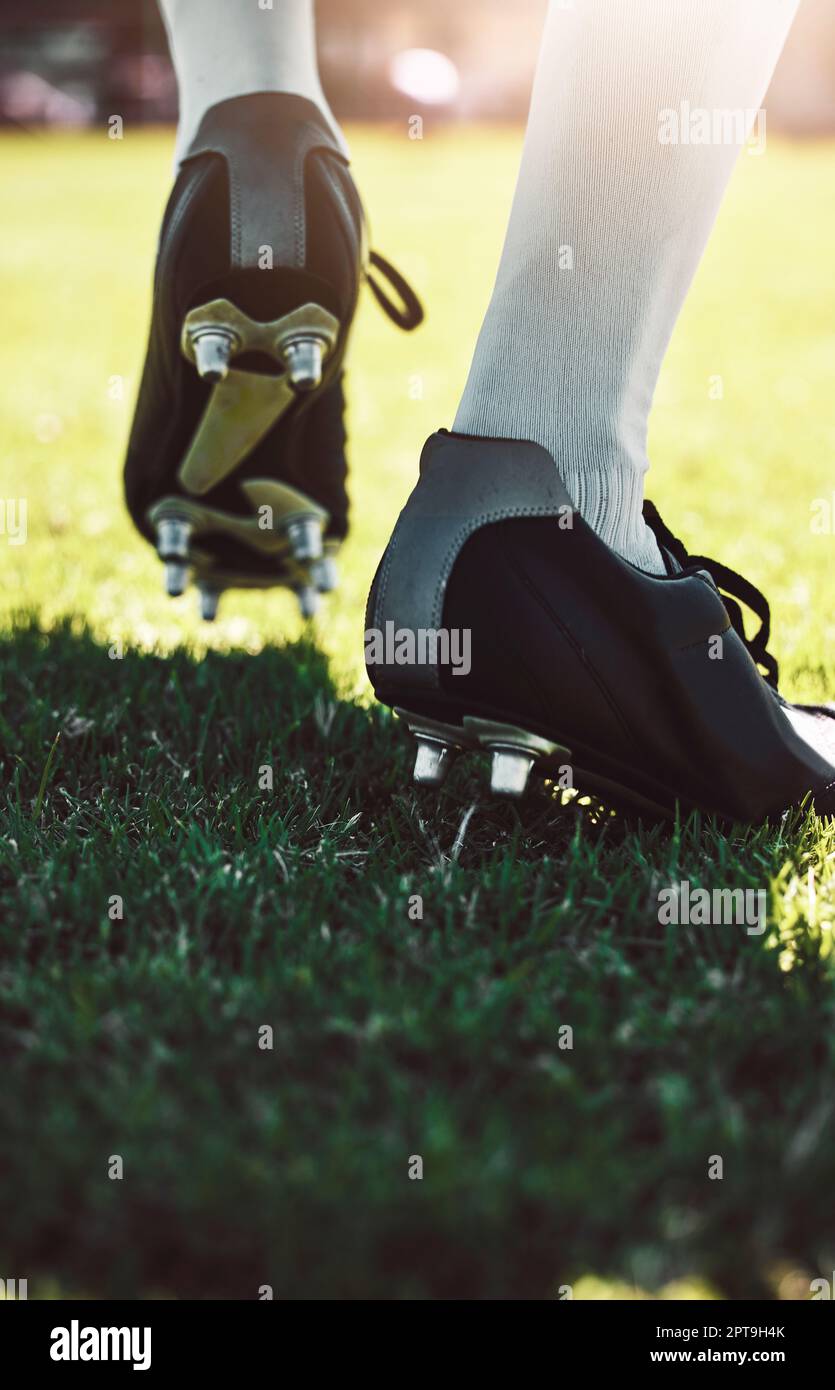 Soccer shoes, soccer player and soccer field by man for training ...