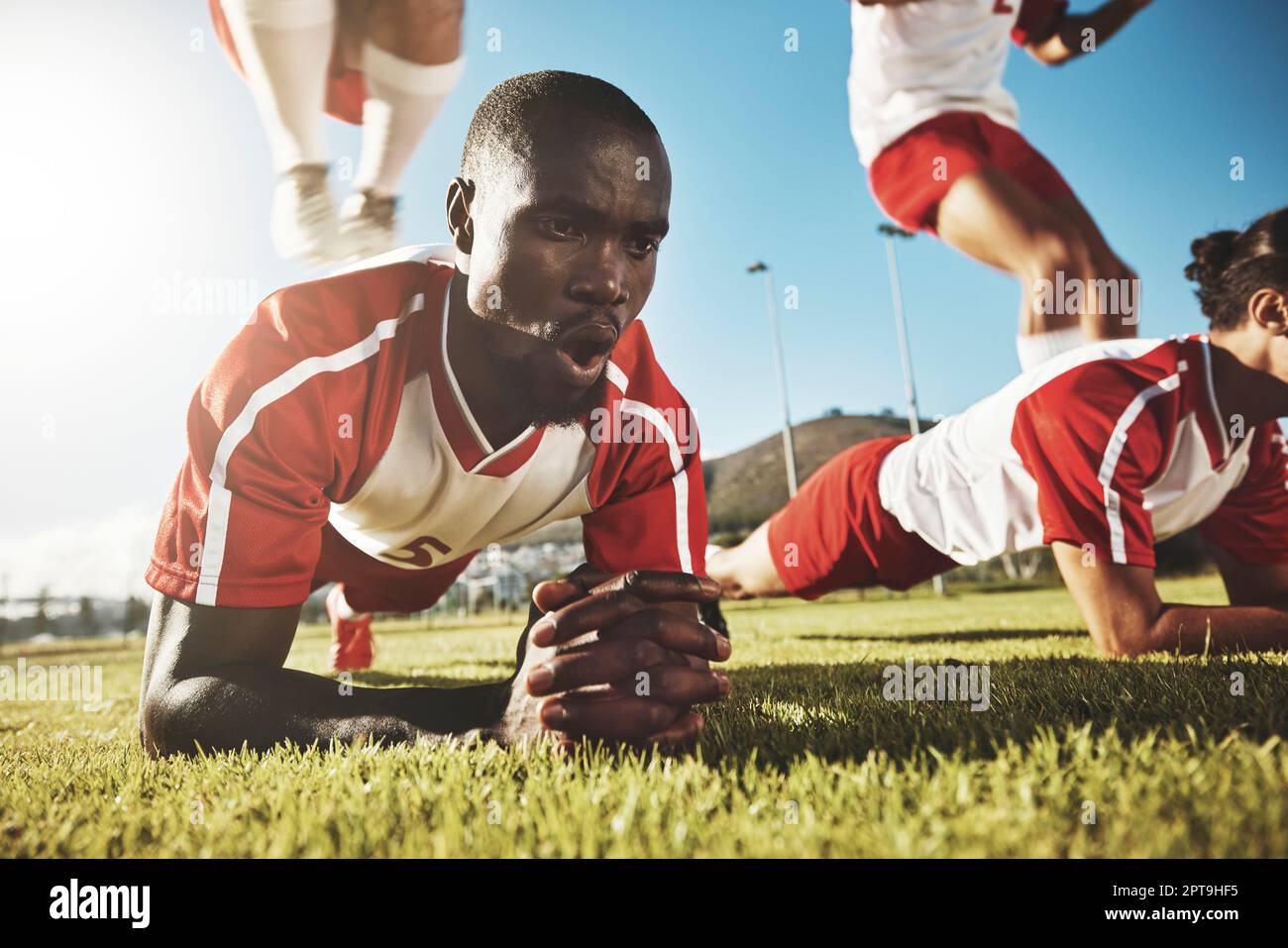 Sports, soccer and football team doing push up before game, match or ...
