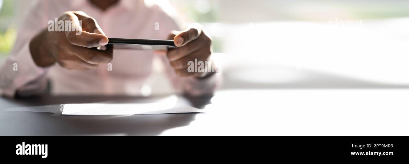 Remote Check Deposit Using Mobile Photo Scanning Stock Photo - Alamy
