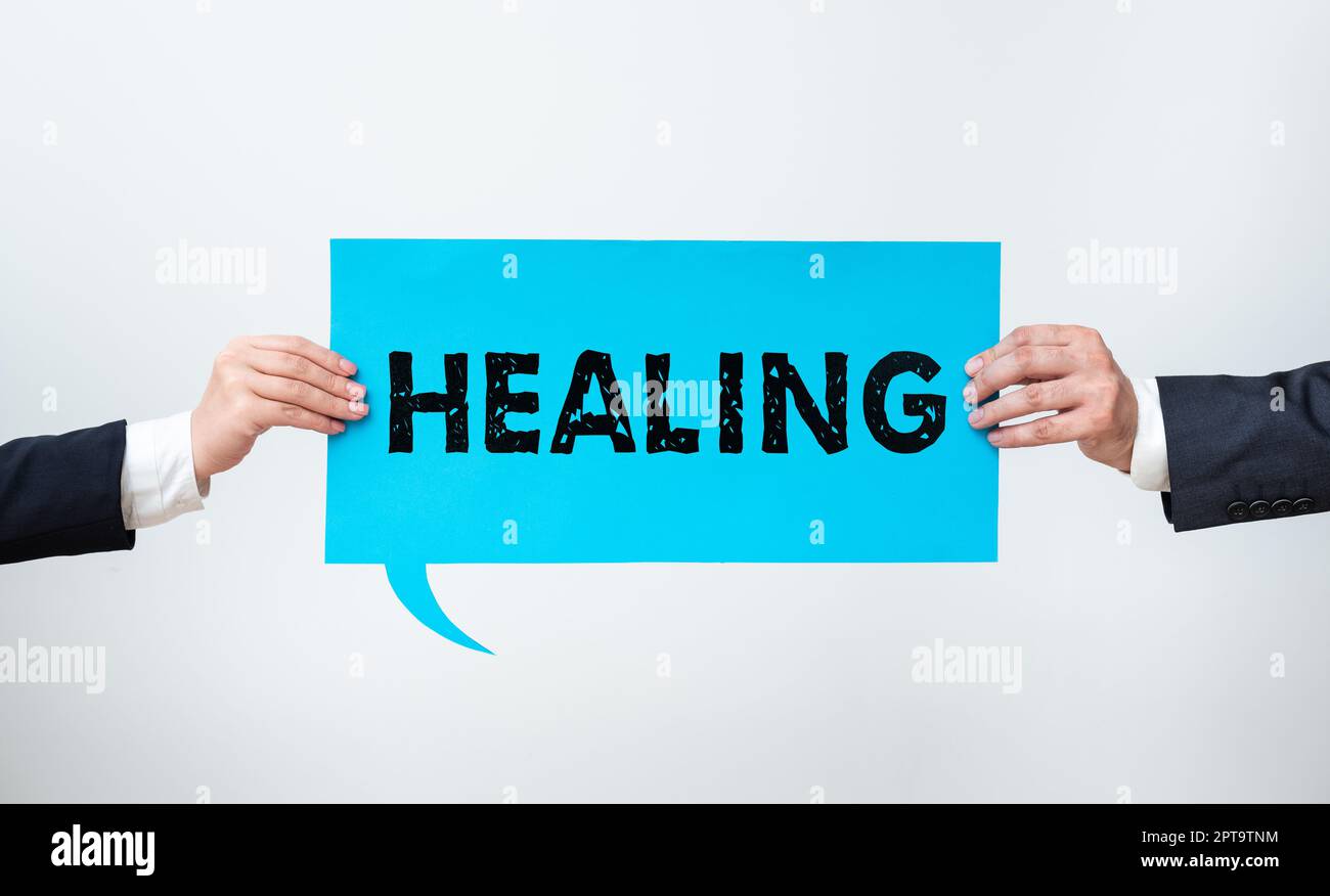 Handwriting text Healing, Word Written on process of the restoration of ...