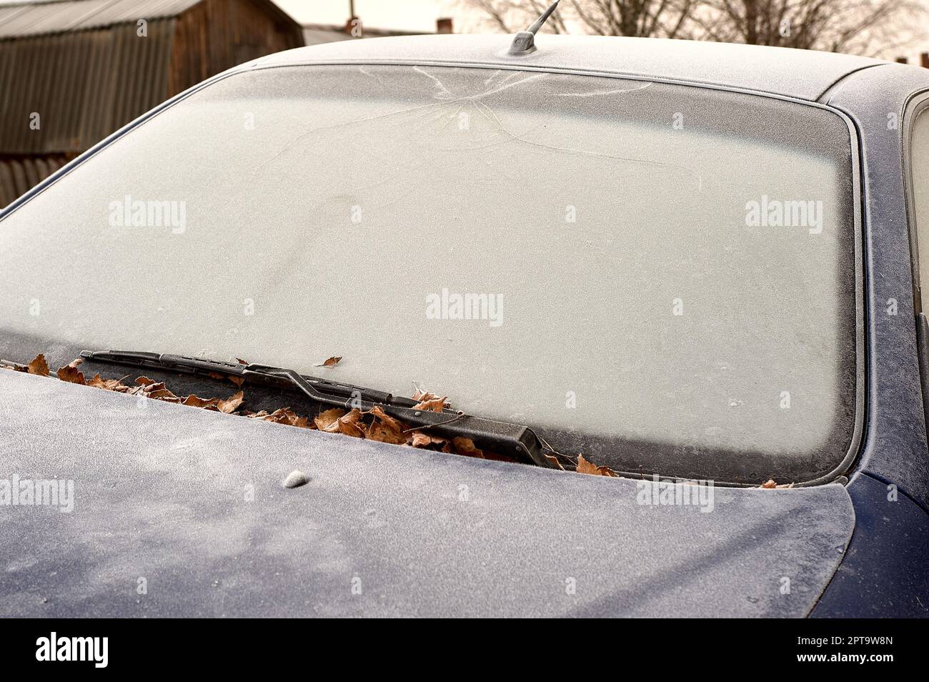 frozen windshield of a passenger car in winter. High quality photo ...