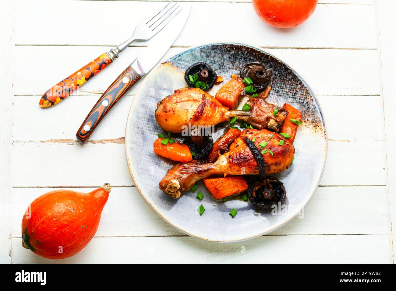 Baked chicken legs with pumpkin and mushrooms. Autumn meat recipe Stock ...