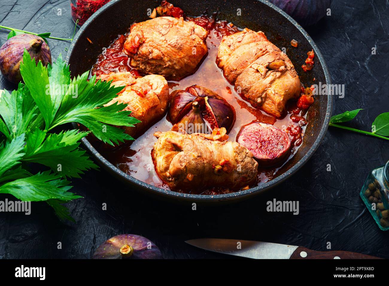 Delicious meat sausage with autumn figs in iron cast pan Stock Photo ...