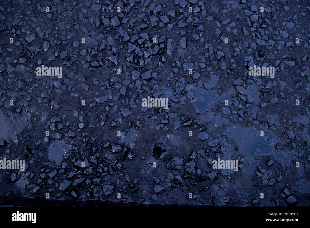 Black Raw bitumen mosaic road stone Texture background Stock Photo - Alamy