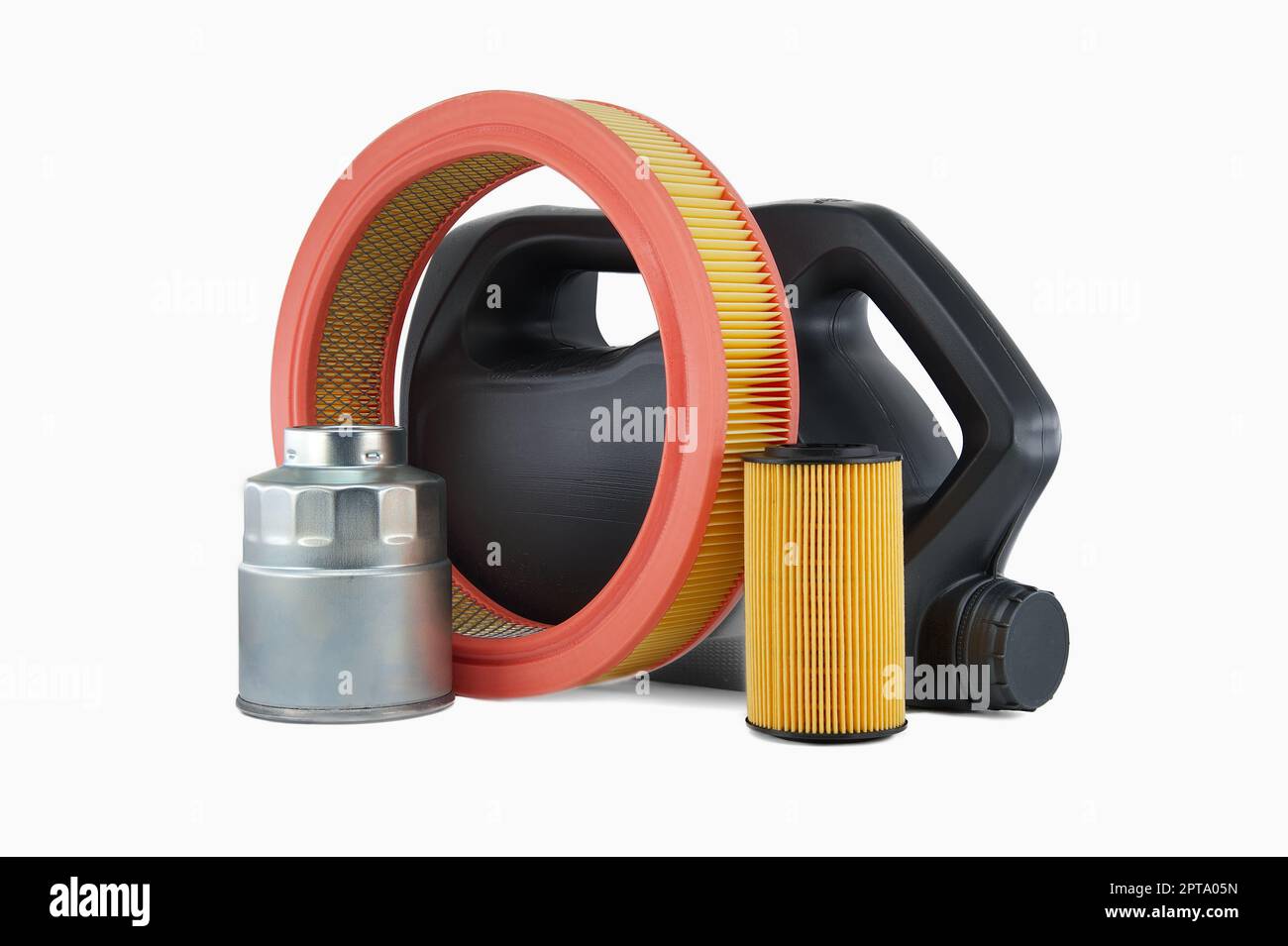 Vehicle engine round air filter, fuel and oil filters near motor oil ...