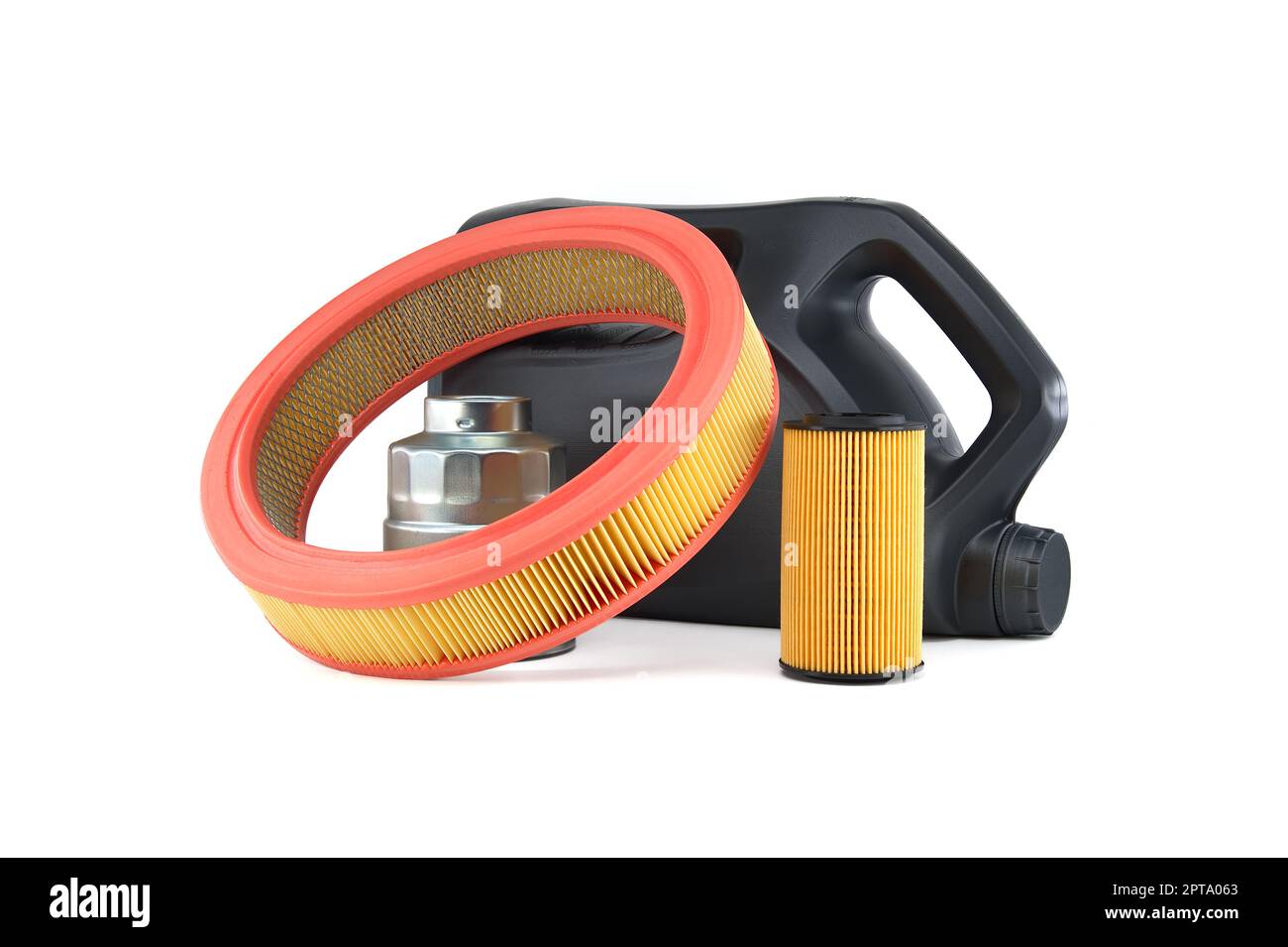 Vehicle engine round air filter, fuel and oil filters near motor oil ...