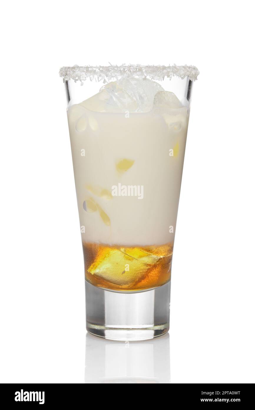 Coconut cream and rum cocktail in highball glass isolated on white ...