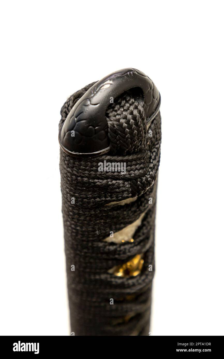 Close up the Kashira: butt cap (or pommel) made of steel on the end of ...