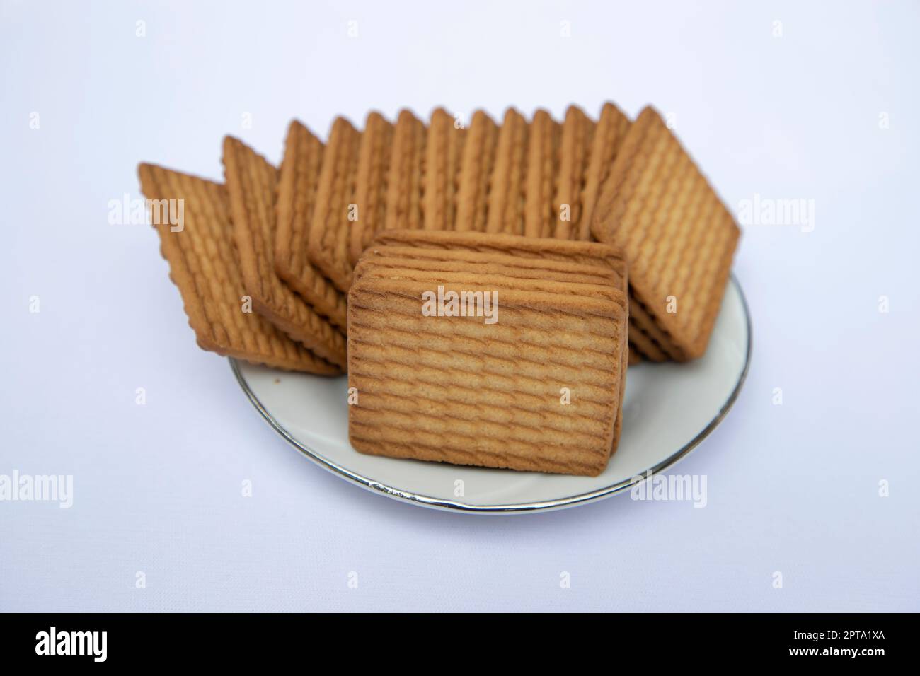 Brown color Wheat biscuits in the Plate isolated on Background Stock ...