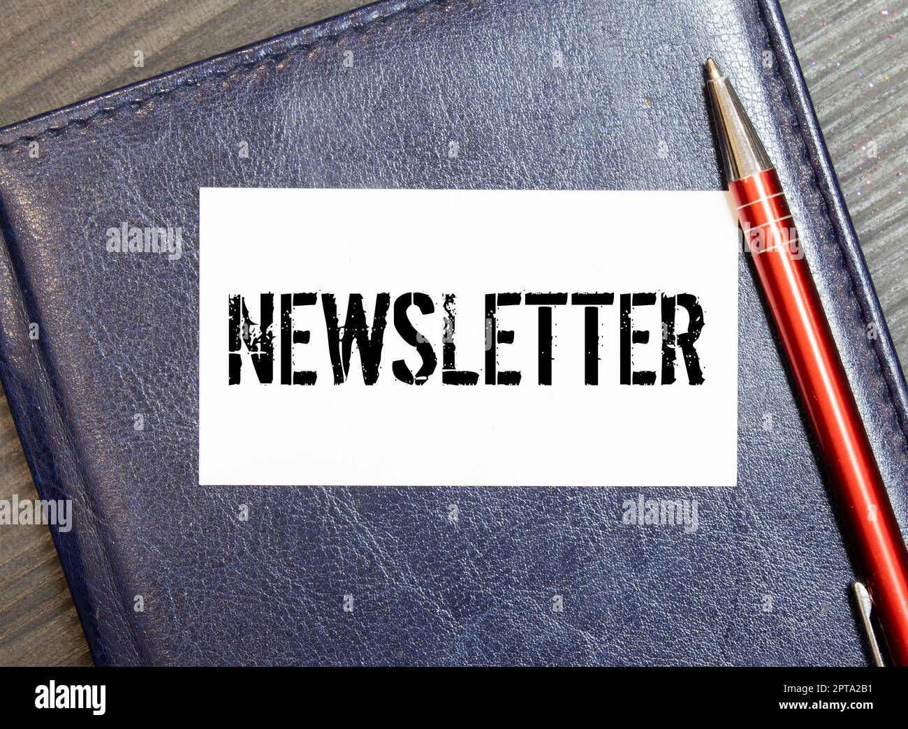 Newsletter text written on a small piece of paper. High resolution ...