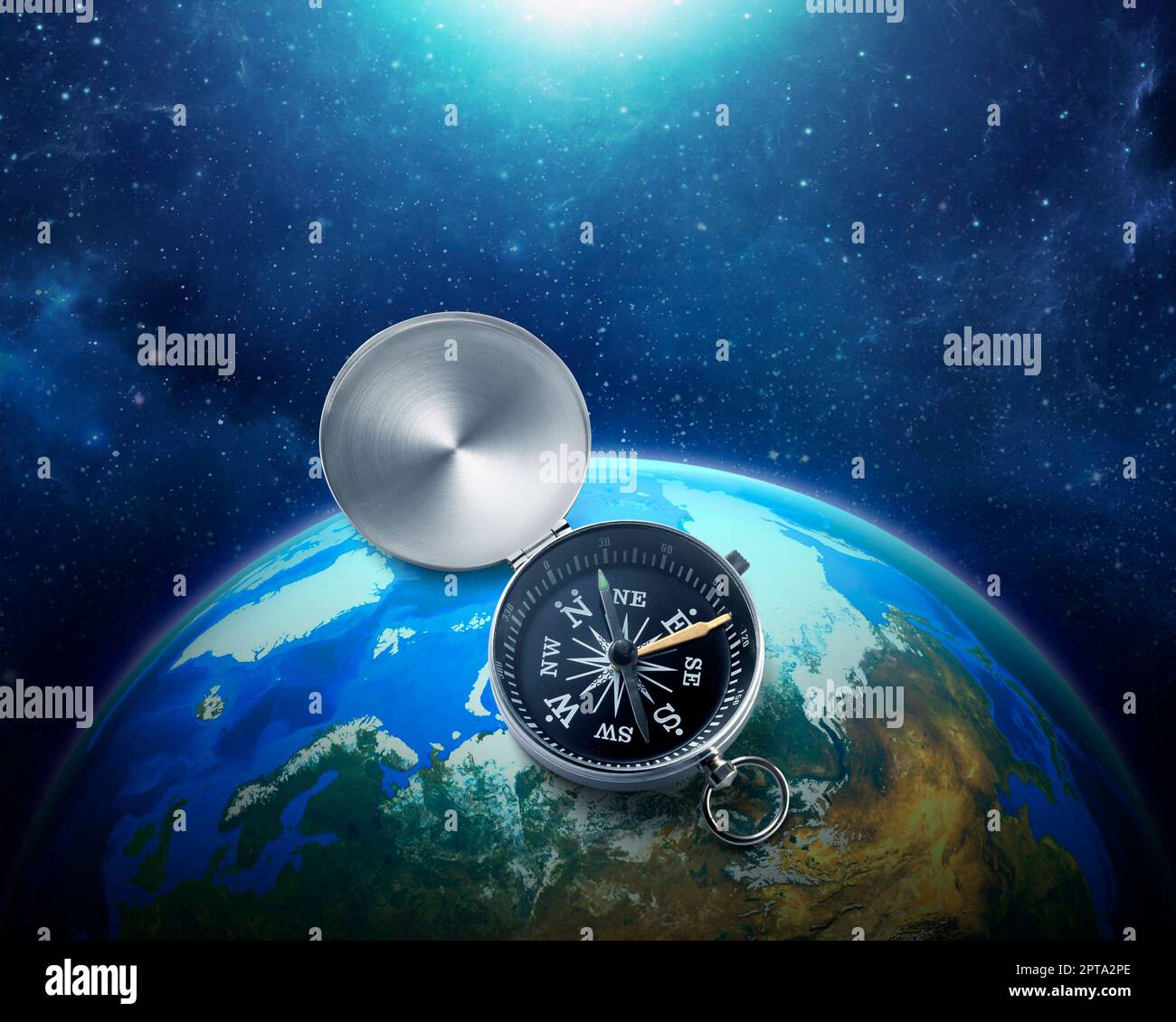 Compass nestled on blue earth in space colorful solar system. . Travel ...