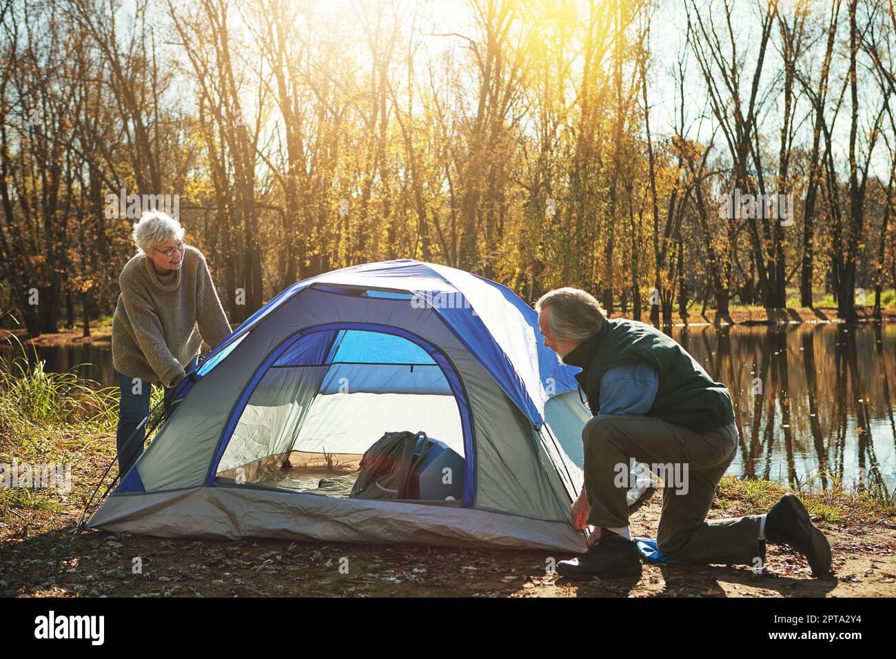 Just two happy campers setting up their cosy nest. a senior couple ...
