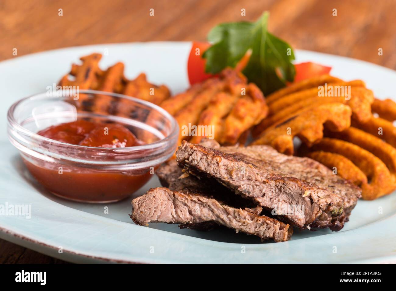 sliced steak with potato grids Stock Photo - Alamy