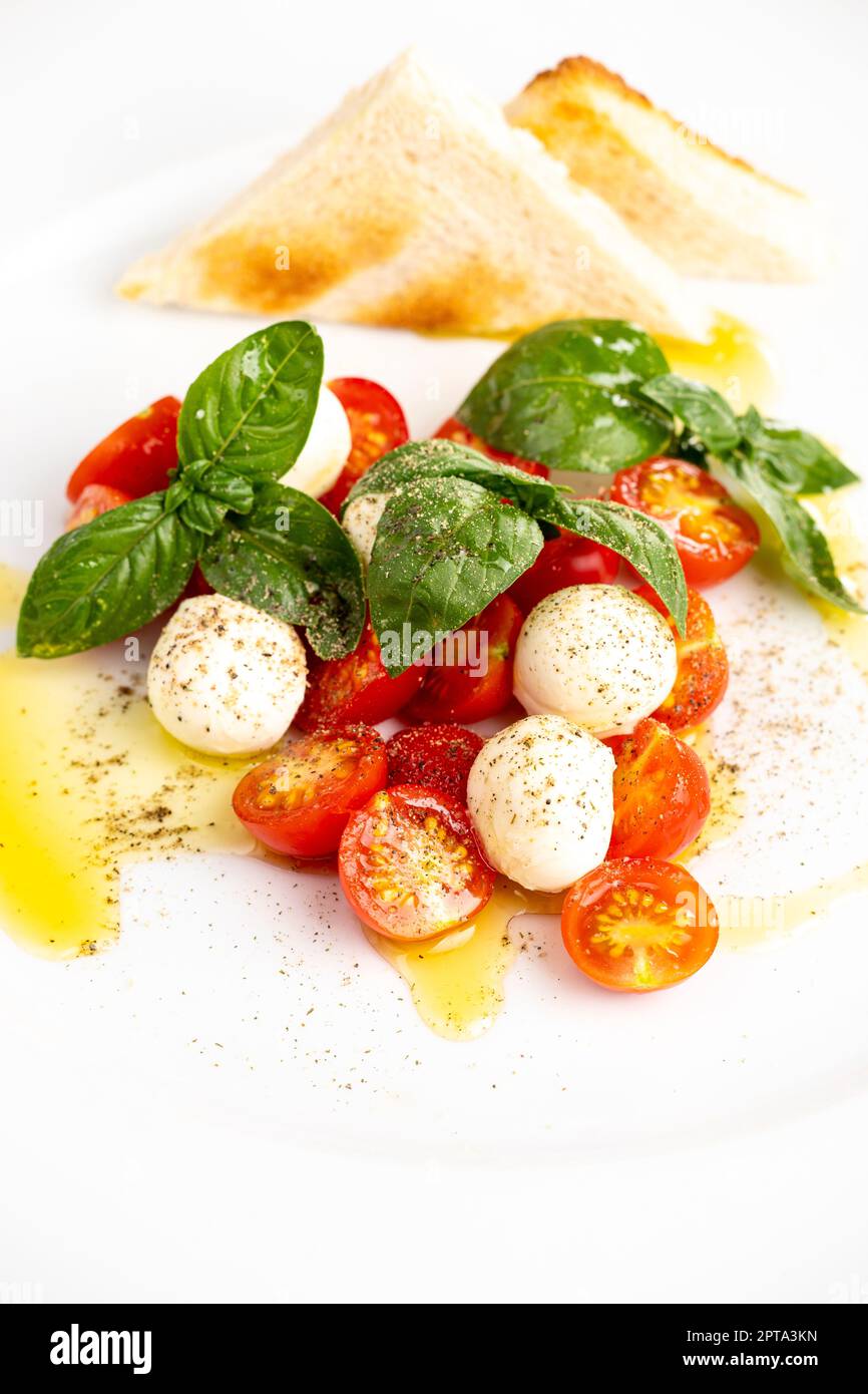 Italian insalada caprese on a white plate hi-res stock photography and ...
