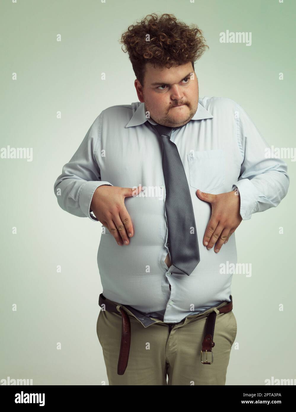 I Think Its Time To Lose Some Weight An Overweight Man Holding His