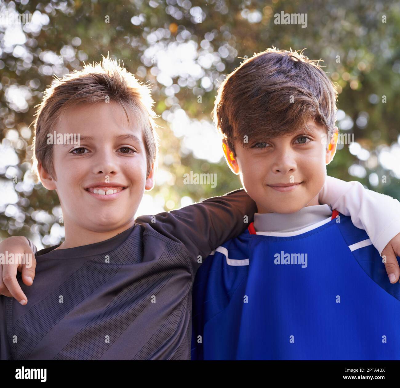 Brothers and friends. Cropped portrait of two young brothers standing ...