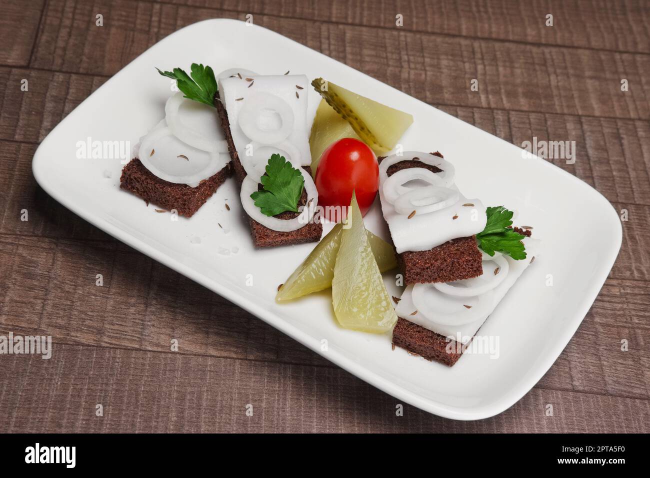 Traditional Russian appetizer to vodka: sandwich with lard and onion ...