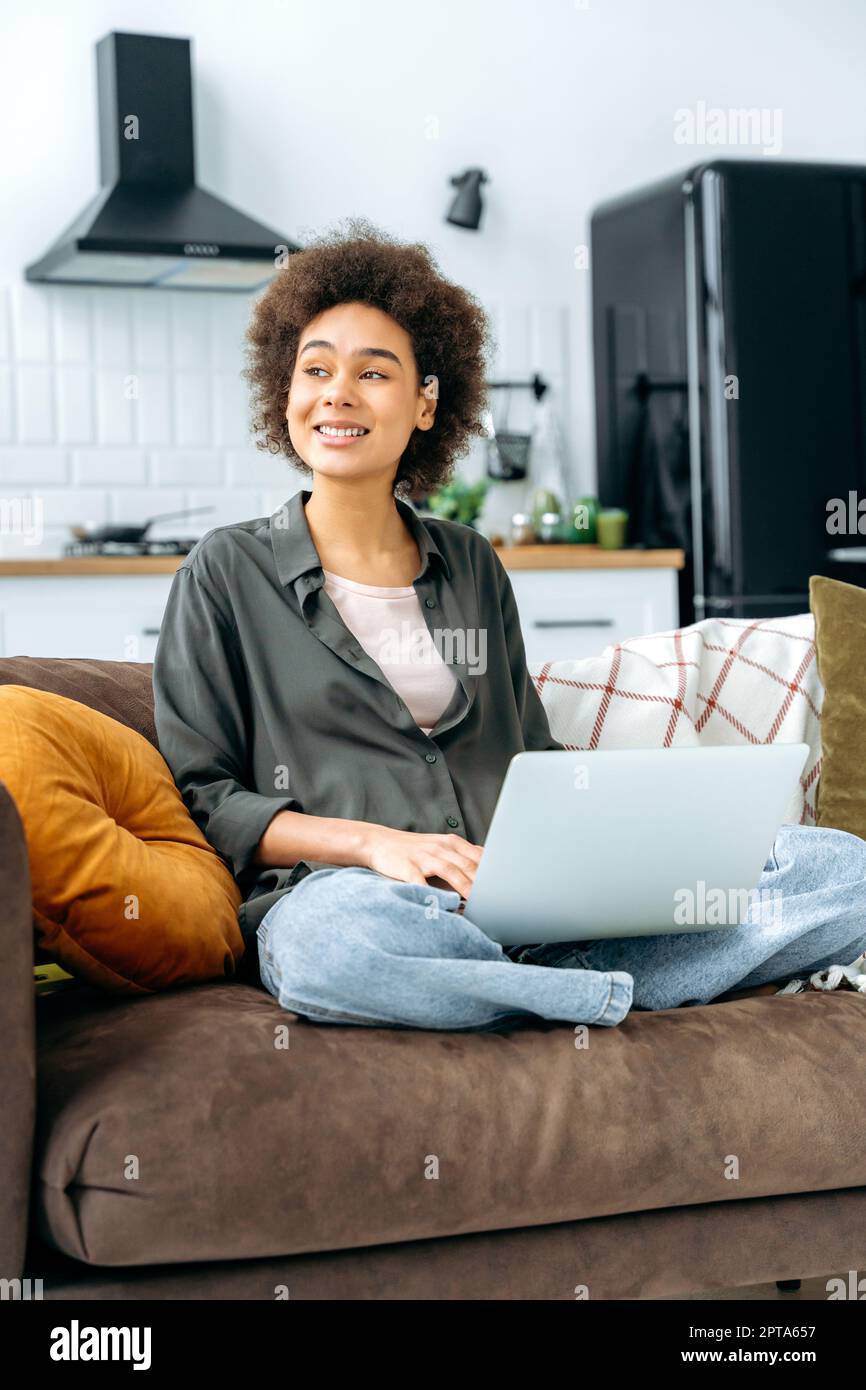 Vertical photo of a lovely young african american woman, student ...