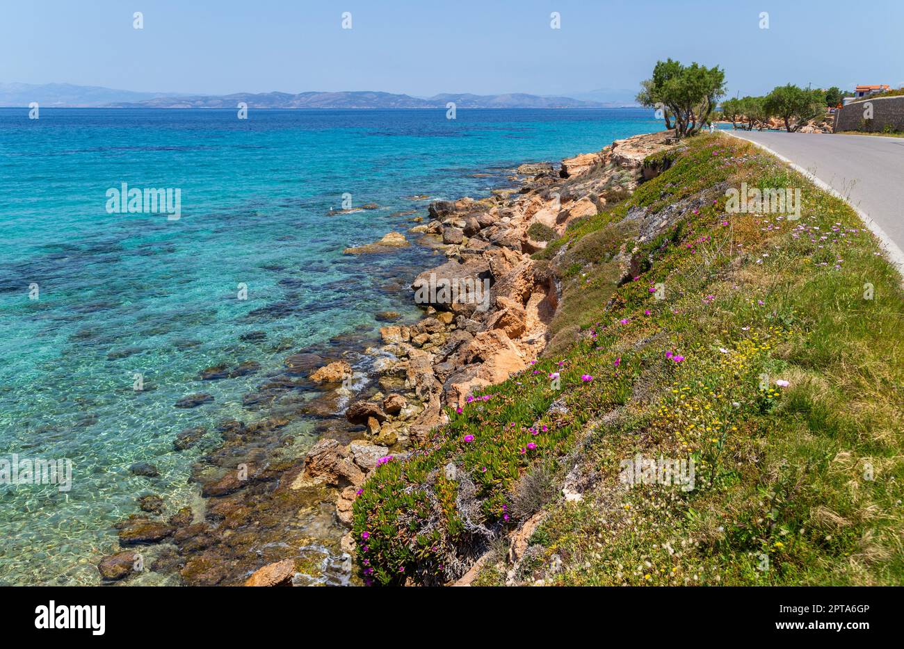 The coast of Aegina island with clear and blue waters of Mediterranean ...