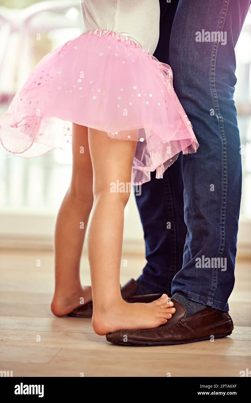 Leading his daughter on a merry little dance. a father and daughter ...