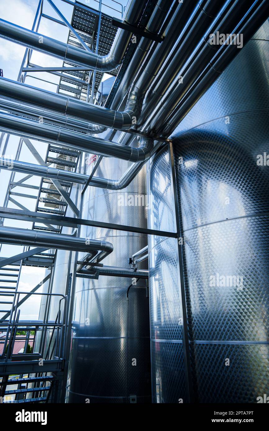 Close up shot of many alloy inox pipes in a factory Stock Photo - Alamy