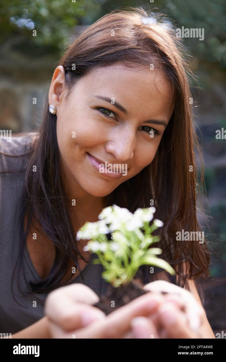 The newest member of my garden club. Close up shot of a young woman ...