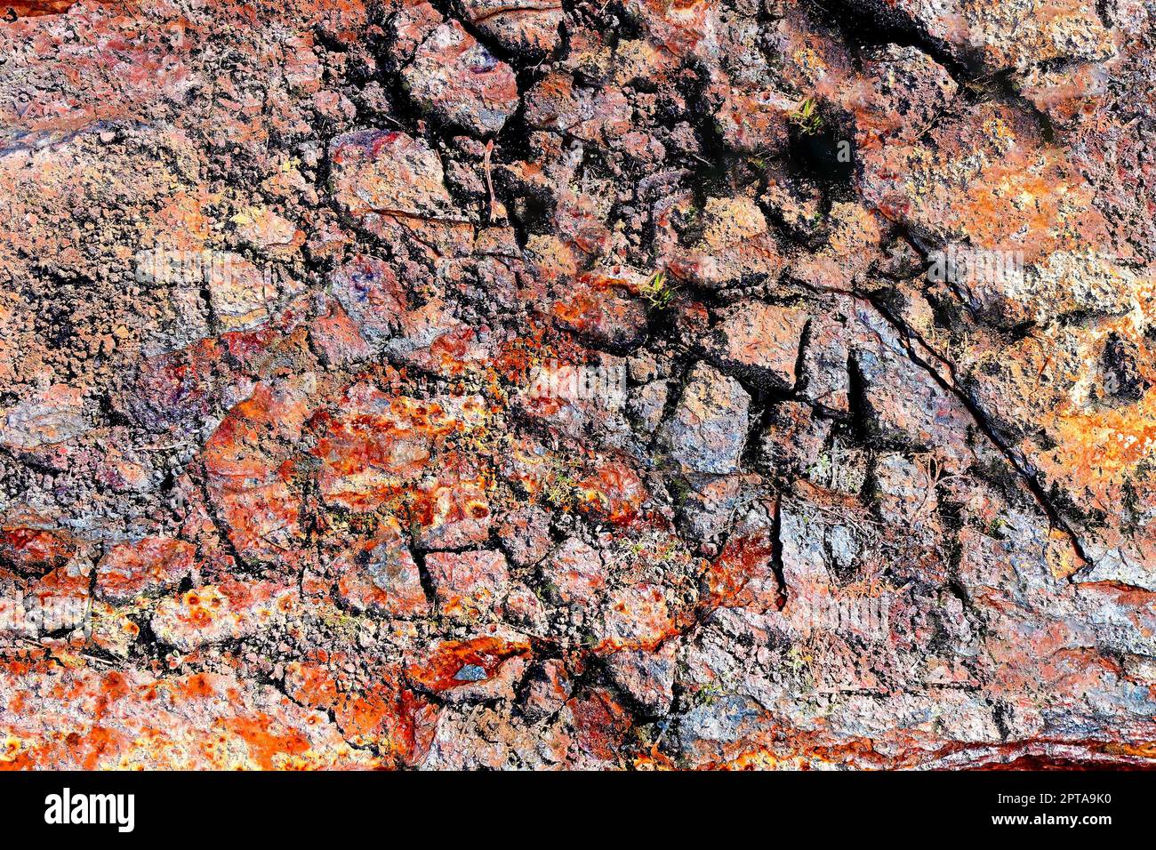 Detailed close up surface of rusty metal and stone with lots of ...