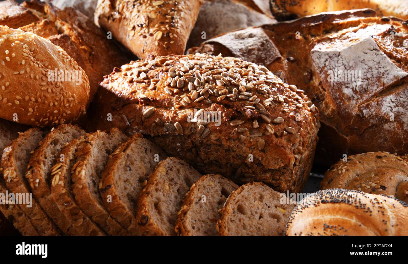 Assorted bakery products including loafs of bread and rolls Stock Photo ...