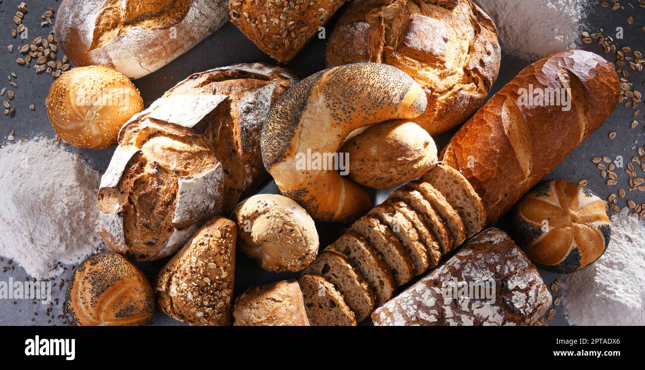 Assorted bakery products including loafs of bread and rolls Stock Photo ...