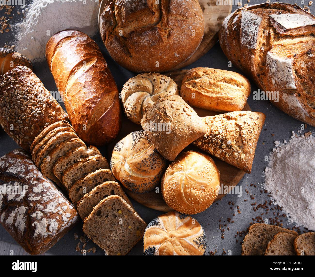 Assorted bakery products including loafs of bread and rolls Stock Photo ...