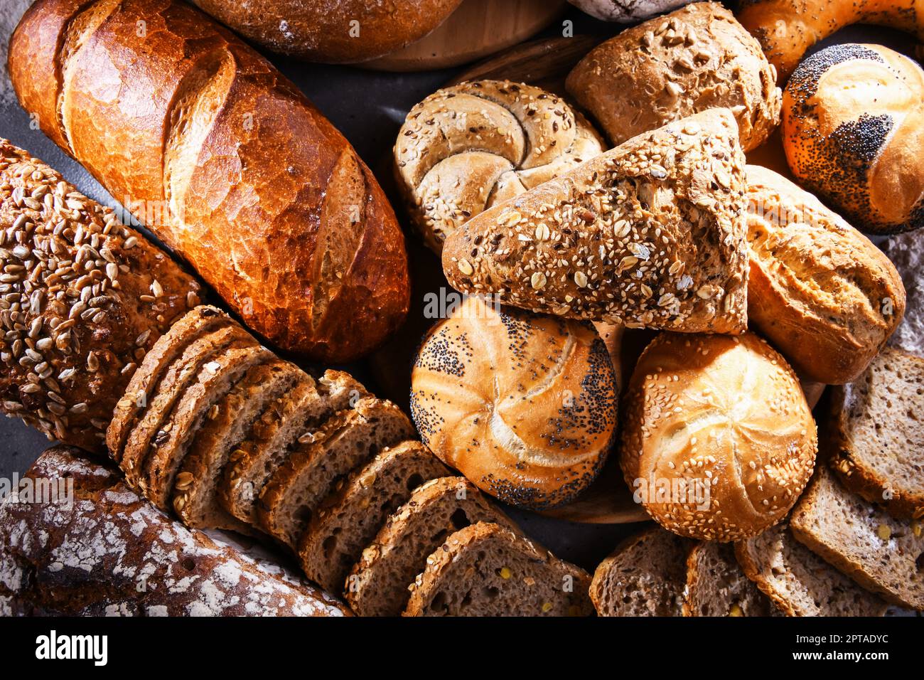 Assorted bakery products including loafs of bread and rolls Stock Photo ...