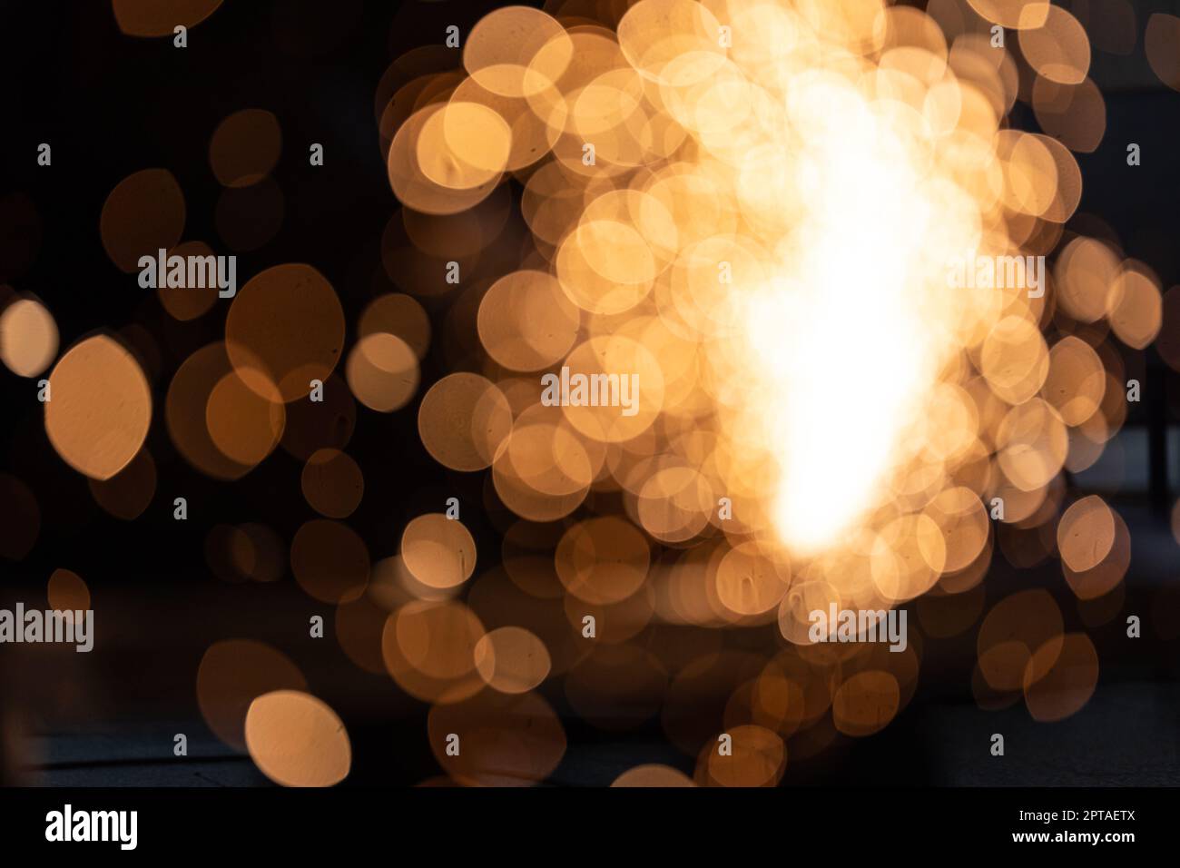 Man working on iron with grinder. Man at work. Sparkles and fire from ...