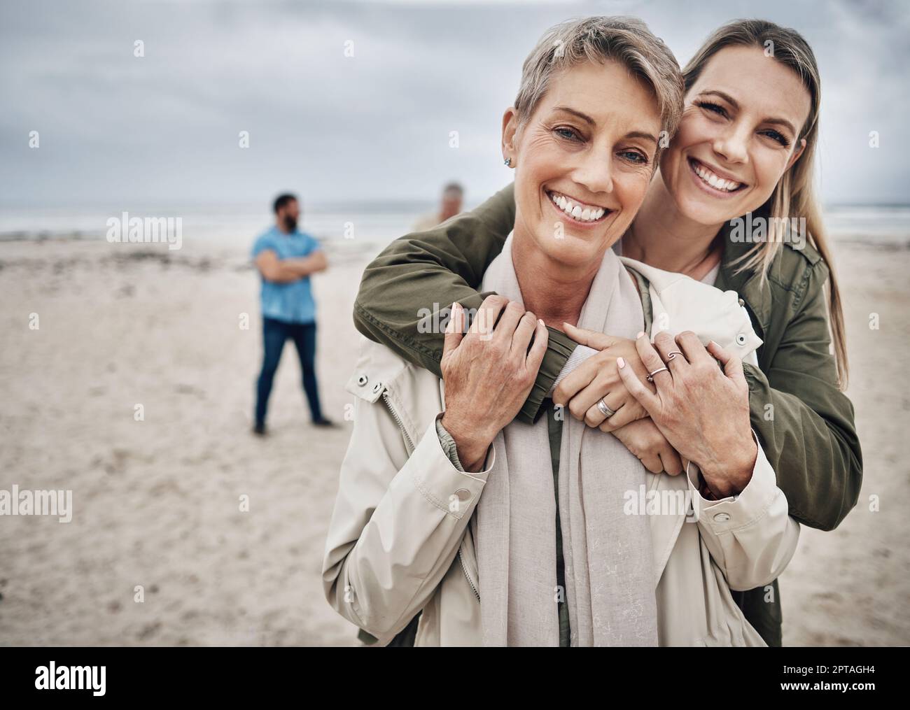 Happy mother hugging daughter beach hi-res stock photography and images ...