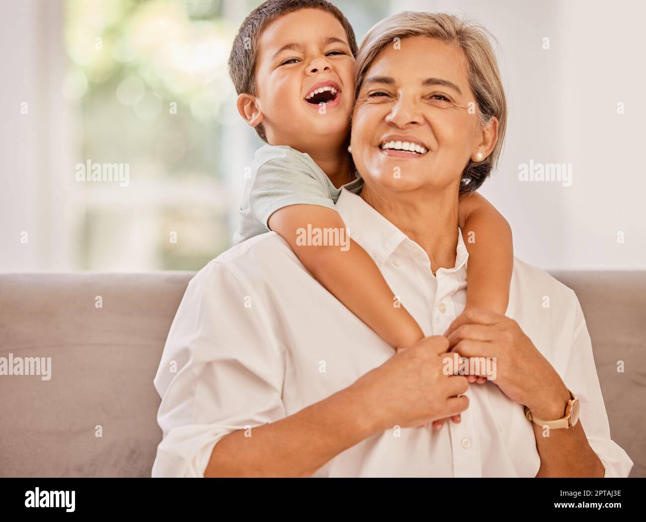 Grandmother, kid and happy family hug bonding together on a home living ...