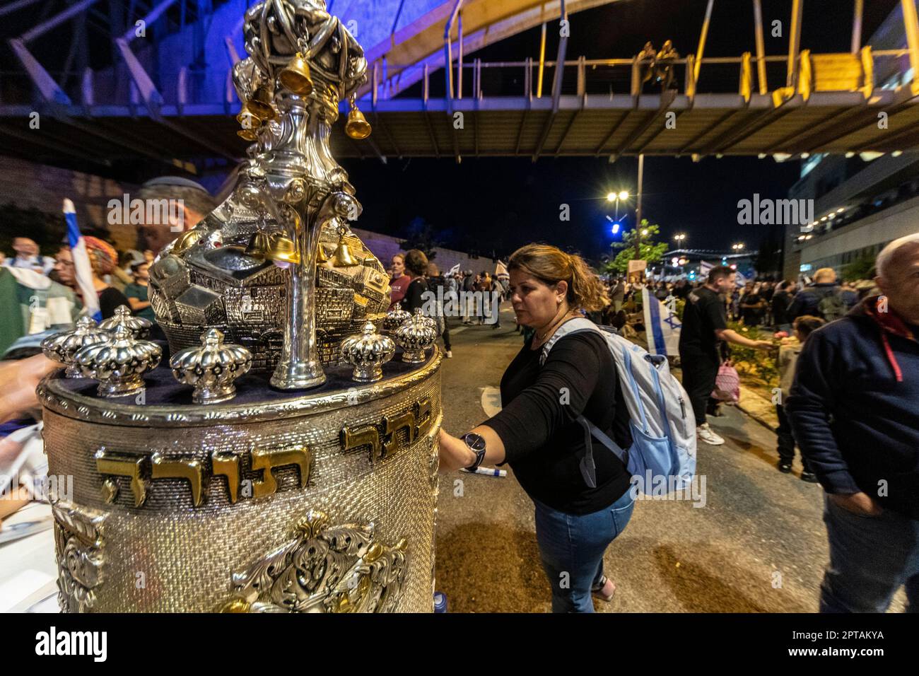 Israel. People with Israeli flags kiss an ornate Torah scroll ...