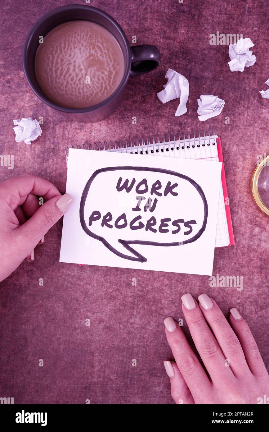 Sign displaying Work In Progress, Business overview Ongoing Business ...