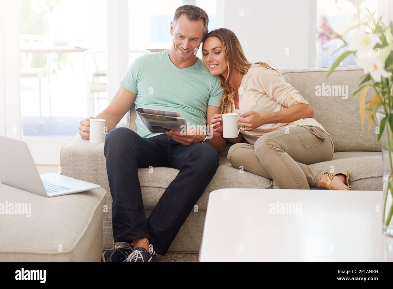 Taking things easy this weekend. a couple relaxing with coffee and the ...