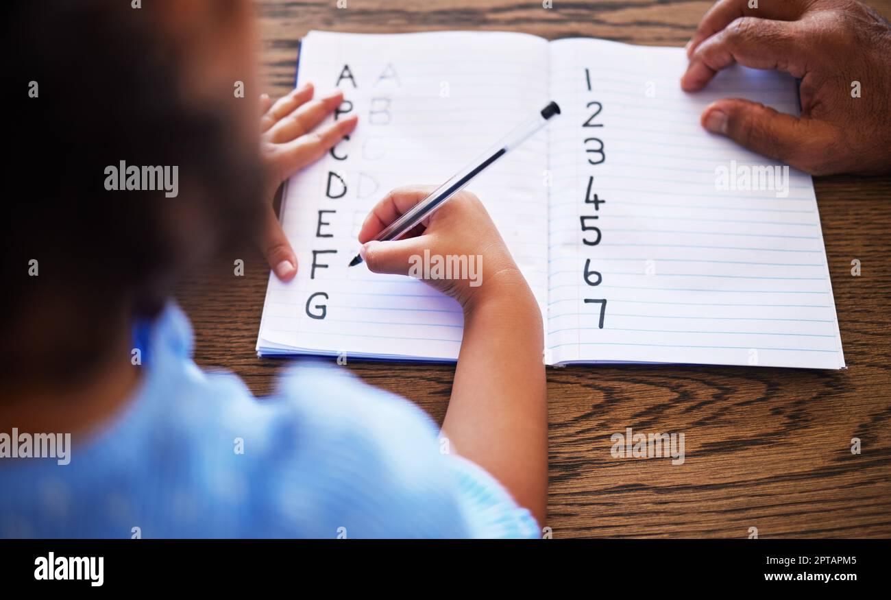 Teacher, learning and child hands writing in book with tutor for ...