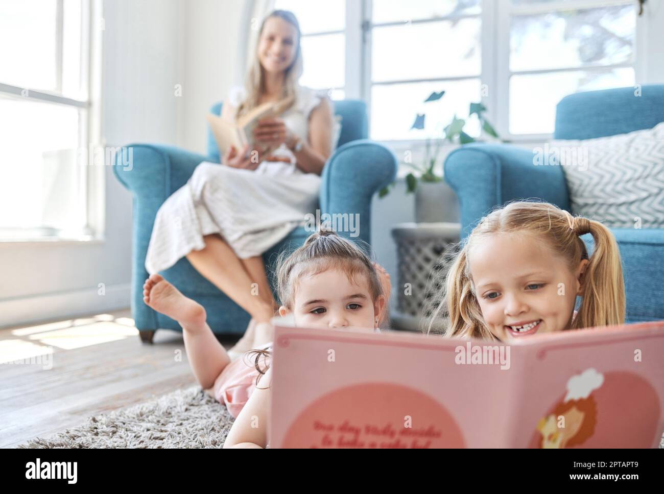 Development, mother and girl children reading with book, smile and ...
