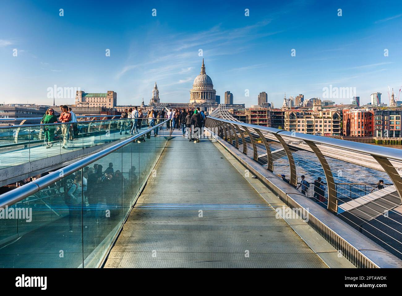 LONDON - APRIL 16, 2022: Walking on the Millennium Bridge, a steel ...