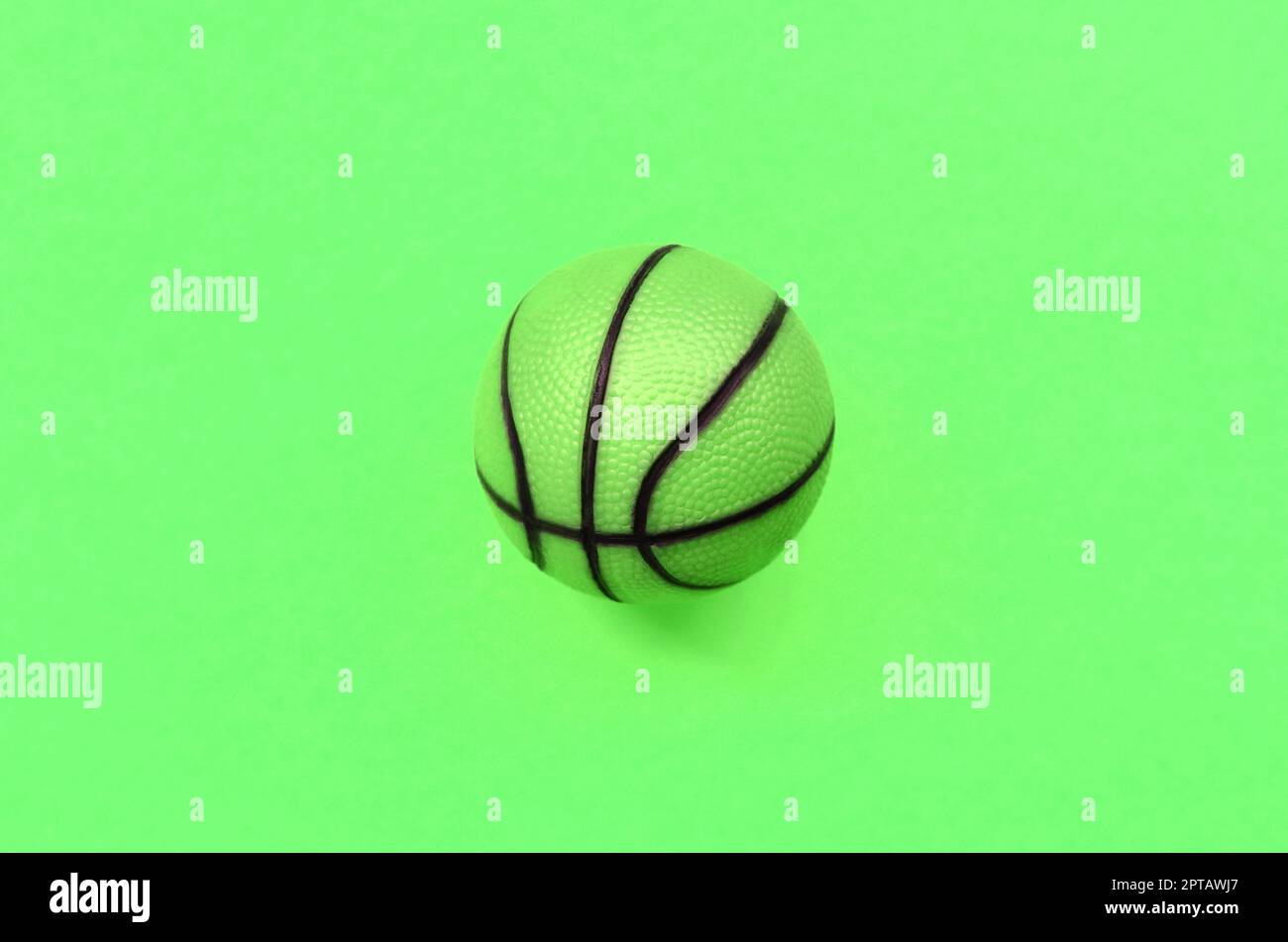 Small green ball for basketball sport game lies on texture background ...