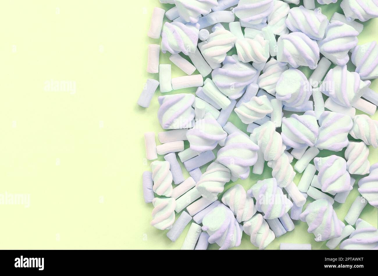 Colorful marshmallow laid out on lime paper background. pastel creative ...