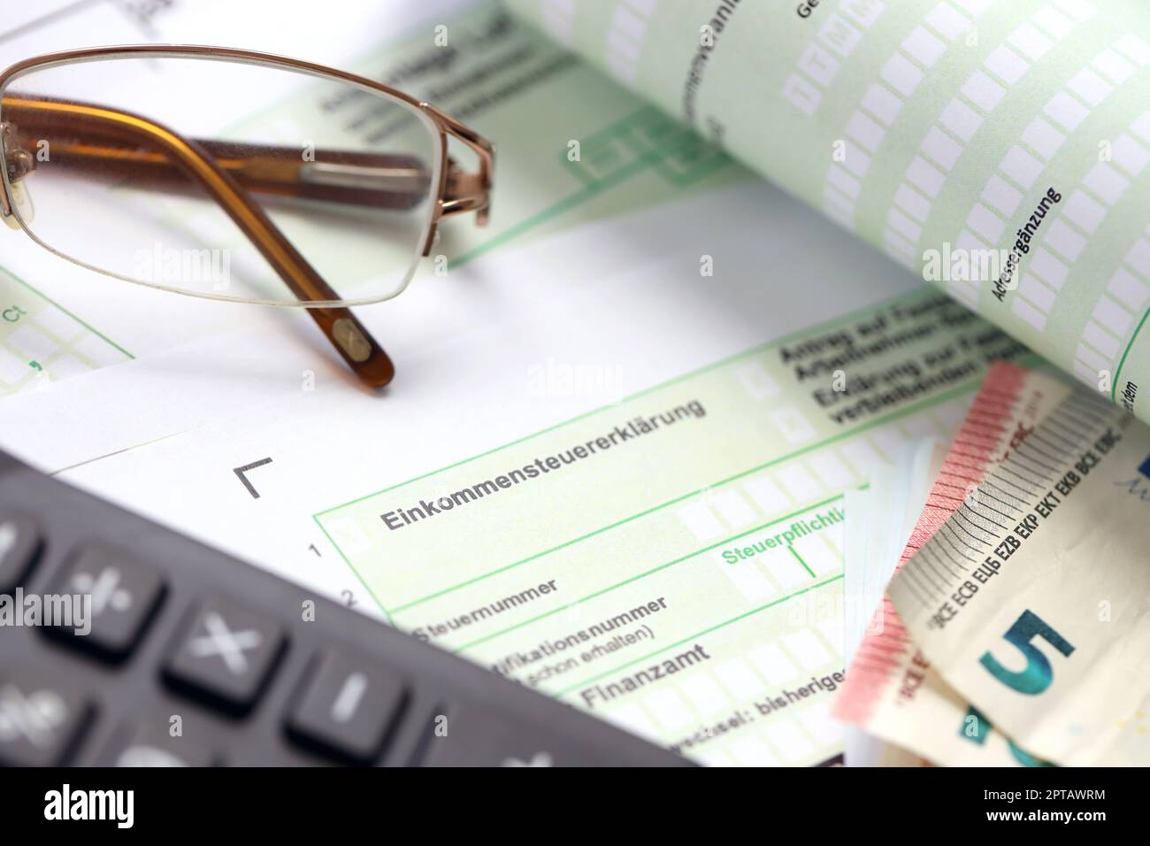 German income tax return form with european euro money bills and ...