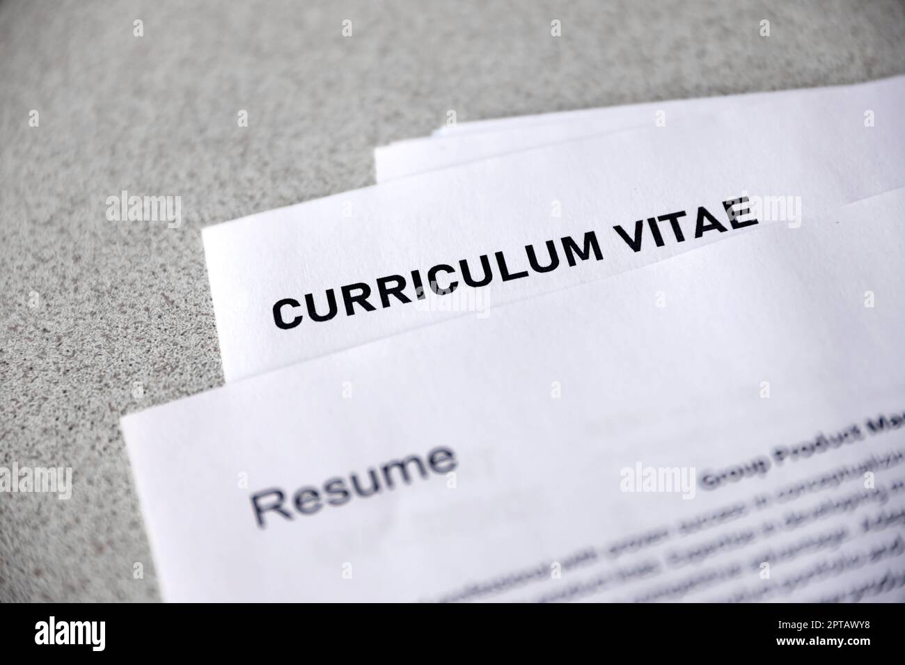 Top view of stack of office documents including resume and cv forms on ...