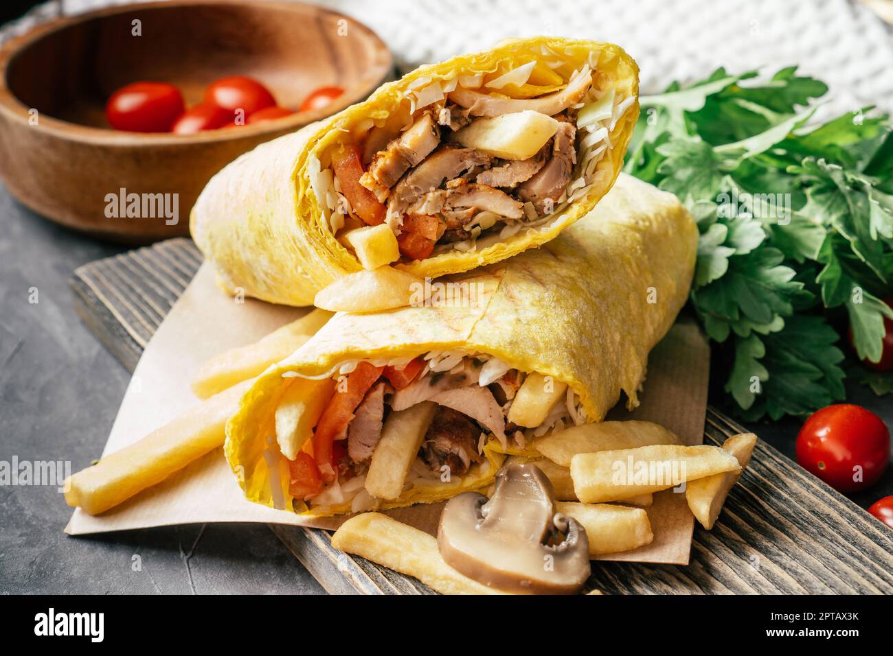 Rustic roll of shawarma with french fries, mushrooms, chicken and ...