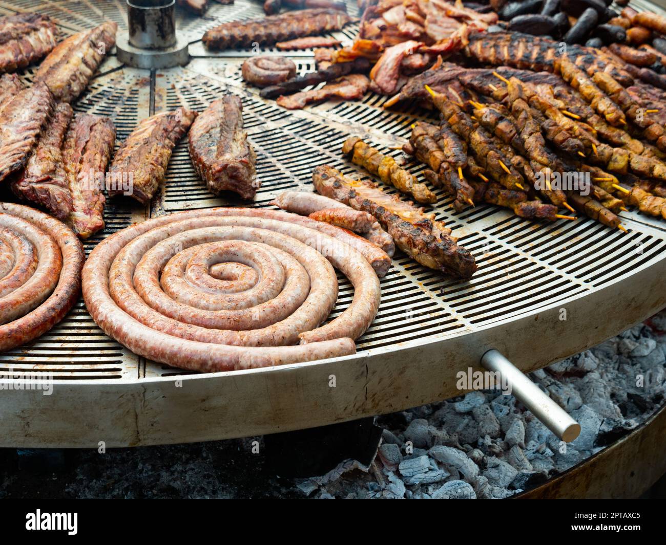 Different types of sausages and meat on grill Stock Photo - Alamy