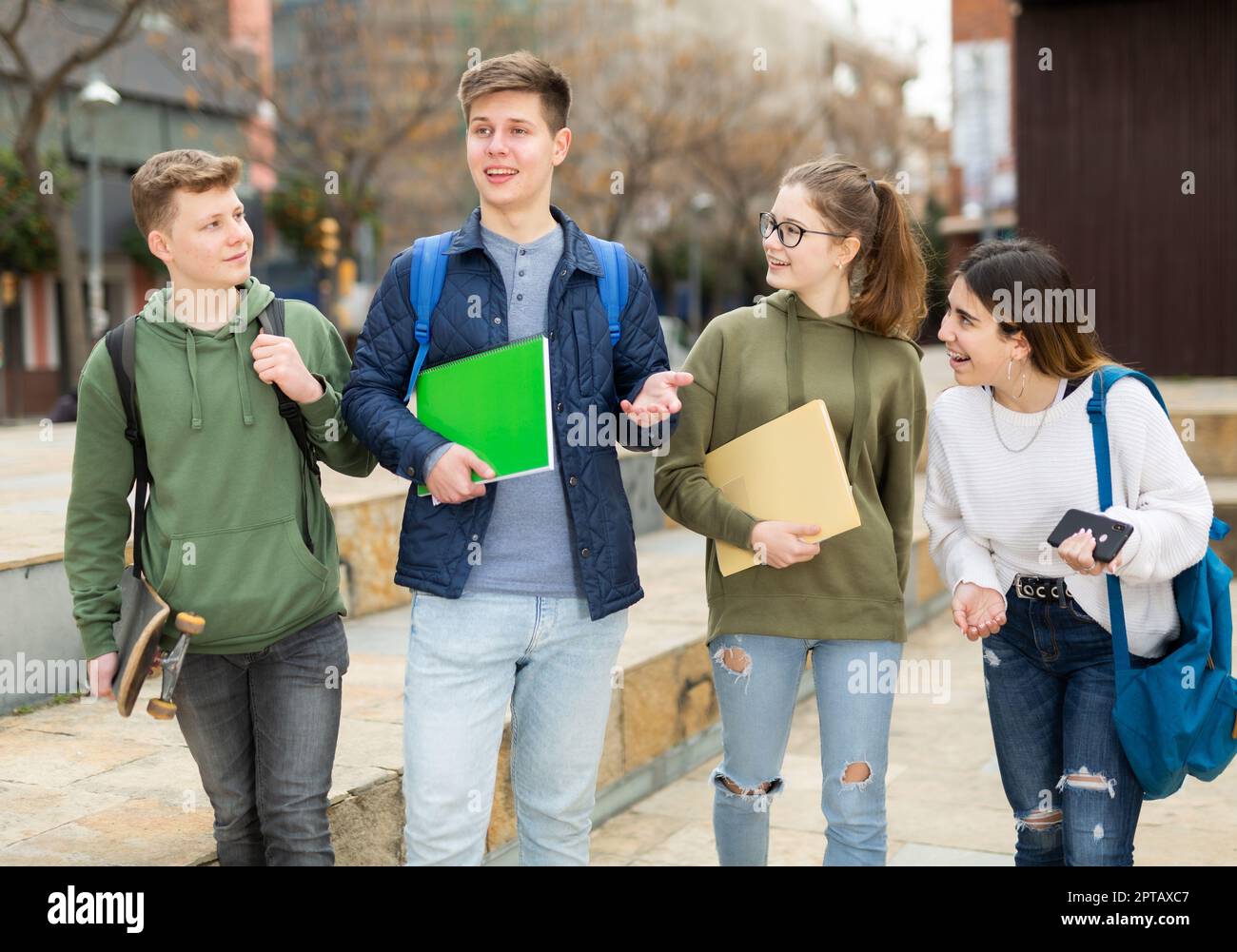 Teenage students talking outside after lessons Stock Photo - Alamy